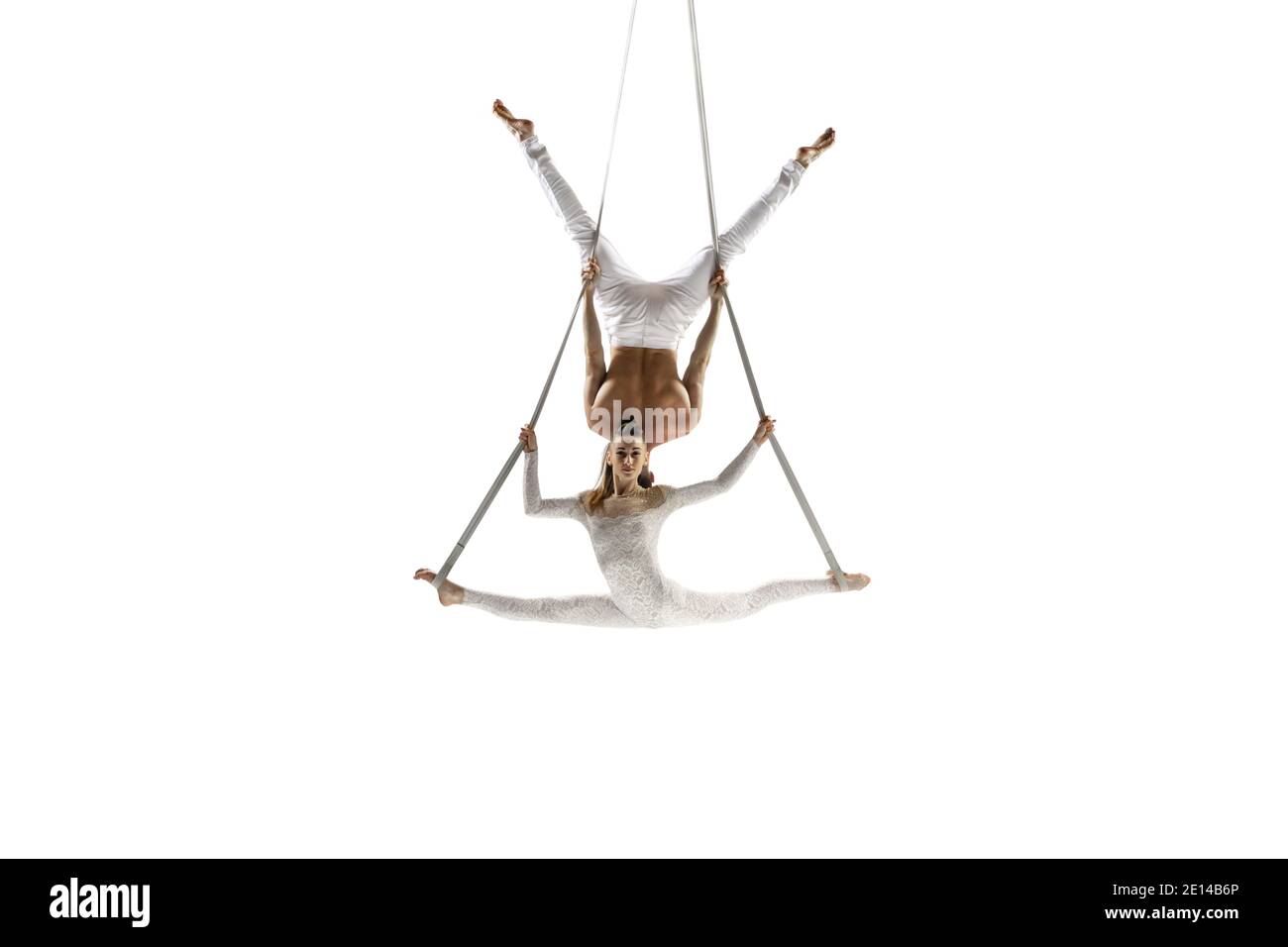 Free falling. Couple of acrobats, circus athletes isolated on white ...