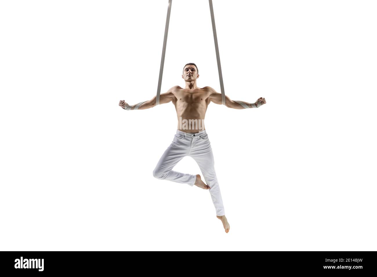Warrior. Young male acrobat, circus athlete isolated on white studio ...