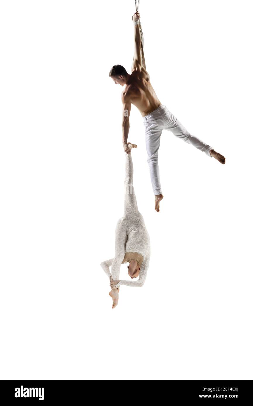 Birds. Couple of acrobats, circus athletes isolated on white studio ...