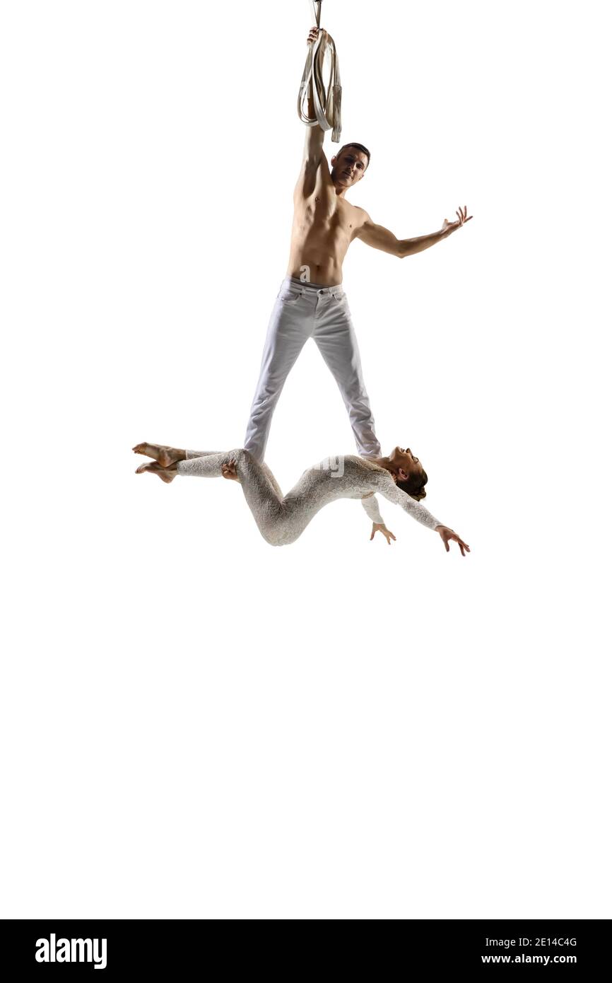 Trophy. Couple of acrobats, circus athletes isolated on white studio ...