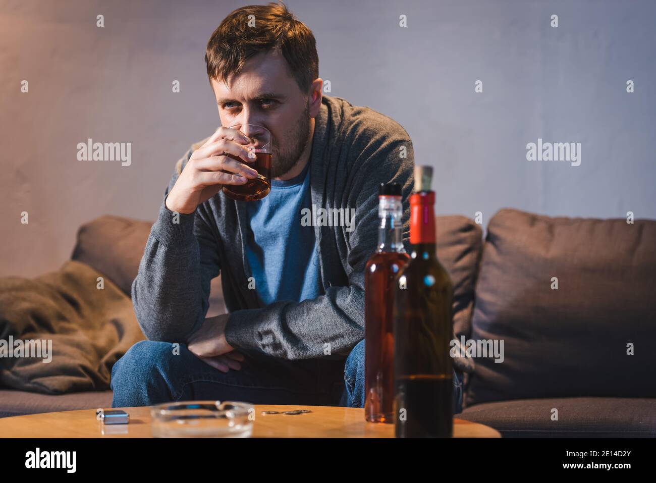 Man drinking alcohol home alone hi-res stock photography and images - Alamy