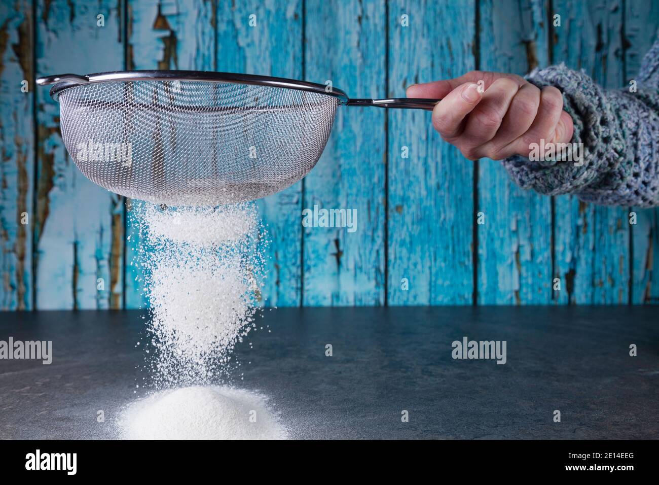 Mature lady sieving flour hi-res stock photography and images - Alamy
