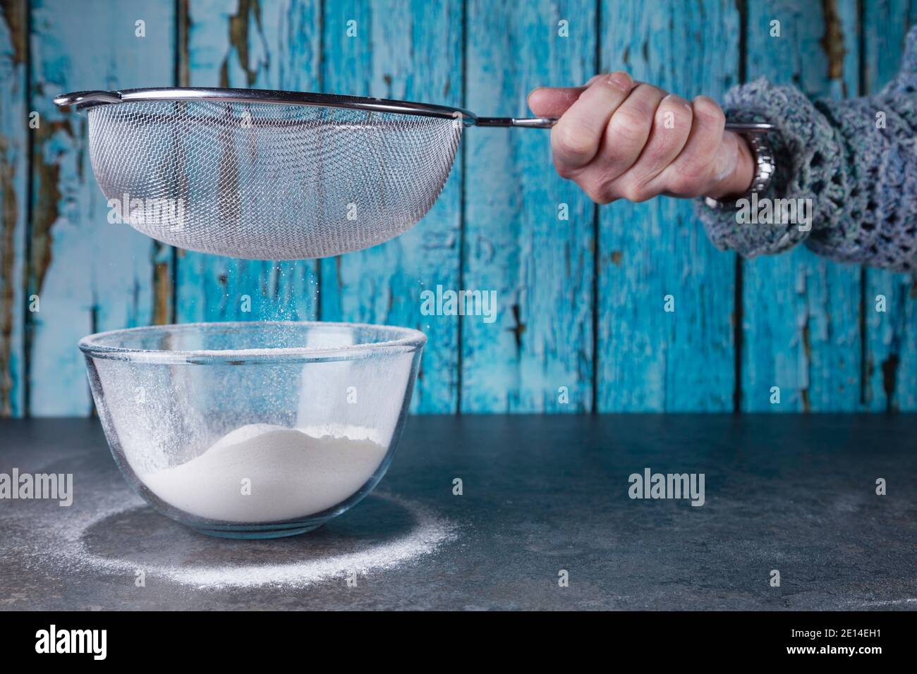 Mature lady sieving flour hi-res stock photography and images - Alamy