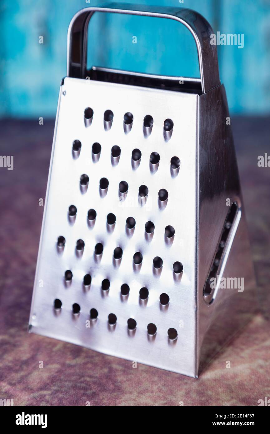 Old stainless steel cheese grater Stock Photo - Alamy