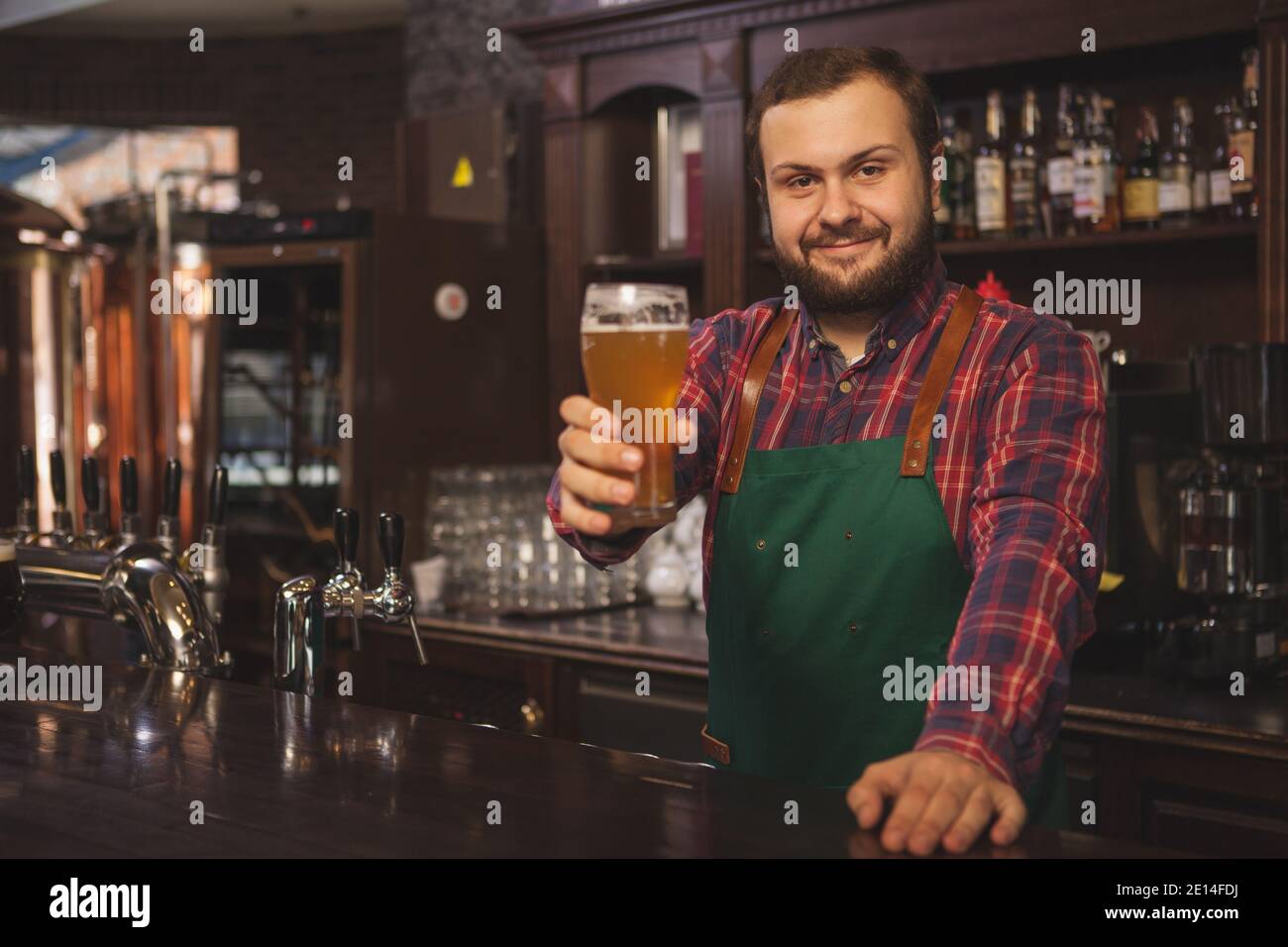 Bartender posing behind bar hi-res stock photography and images - Alamy