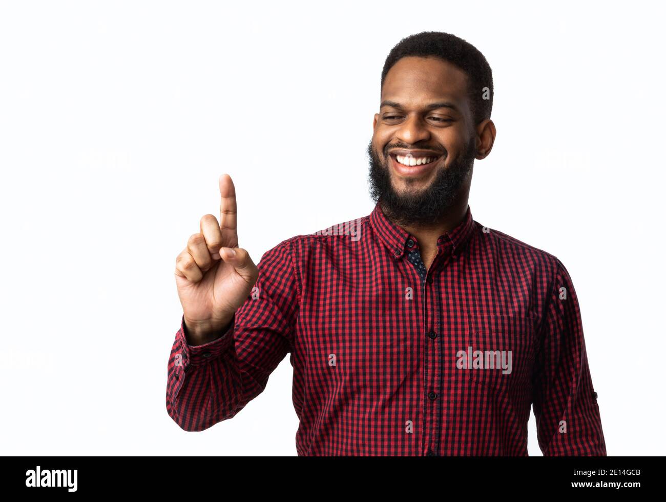 Smiling African Man Holding Invisible Object On Finger, White ...