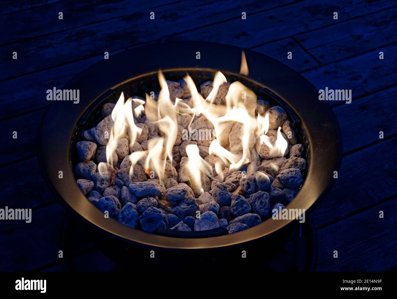 Flames from a portable fire pit or grill operated by propane gas Stock ...