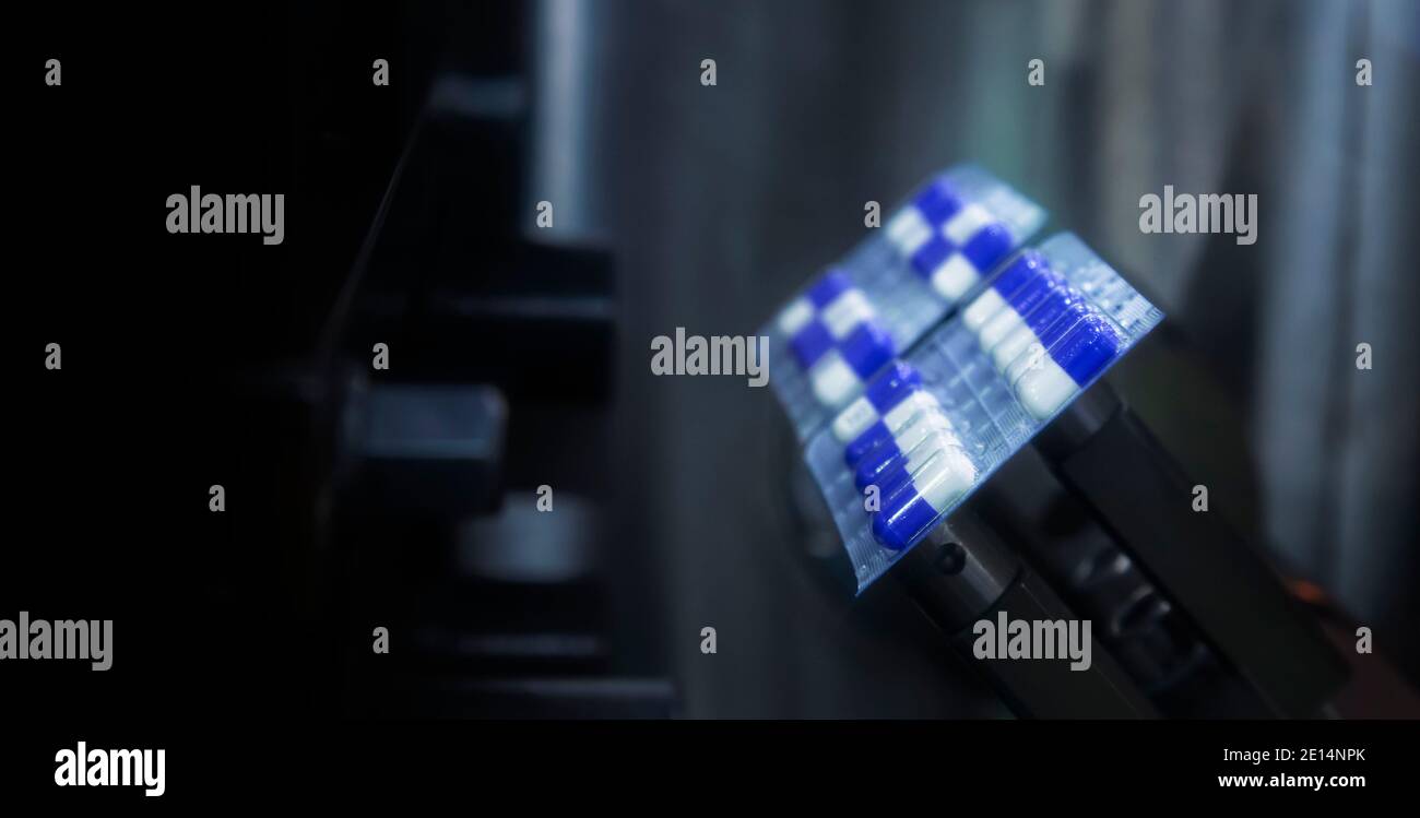 capsule pill ready on medicine aluminum foil packaging in the process ...