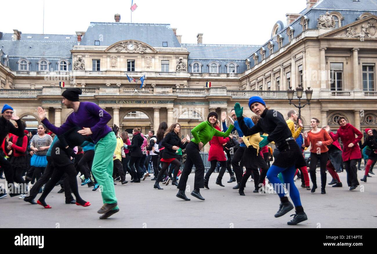 Paris, France - December 9, 2012: People dance at Palais Royal square ...