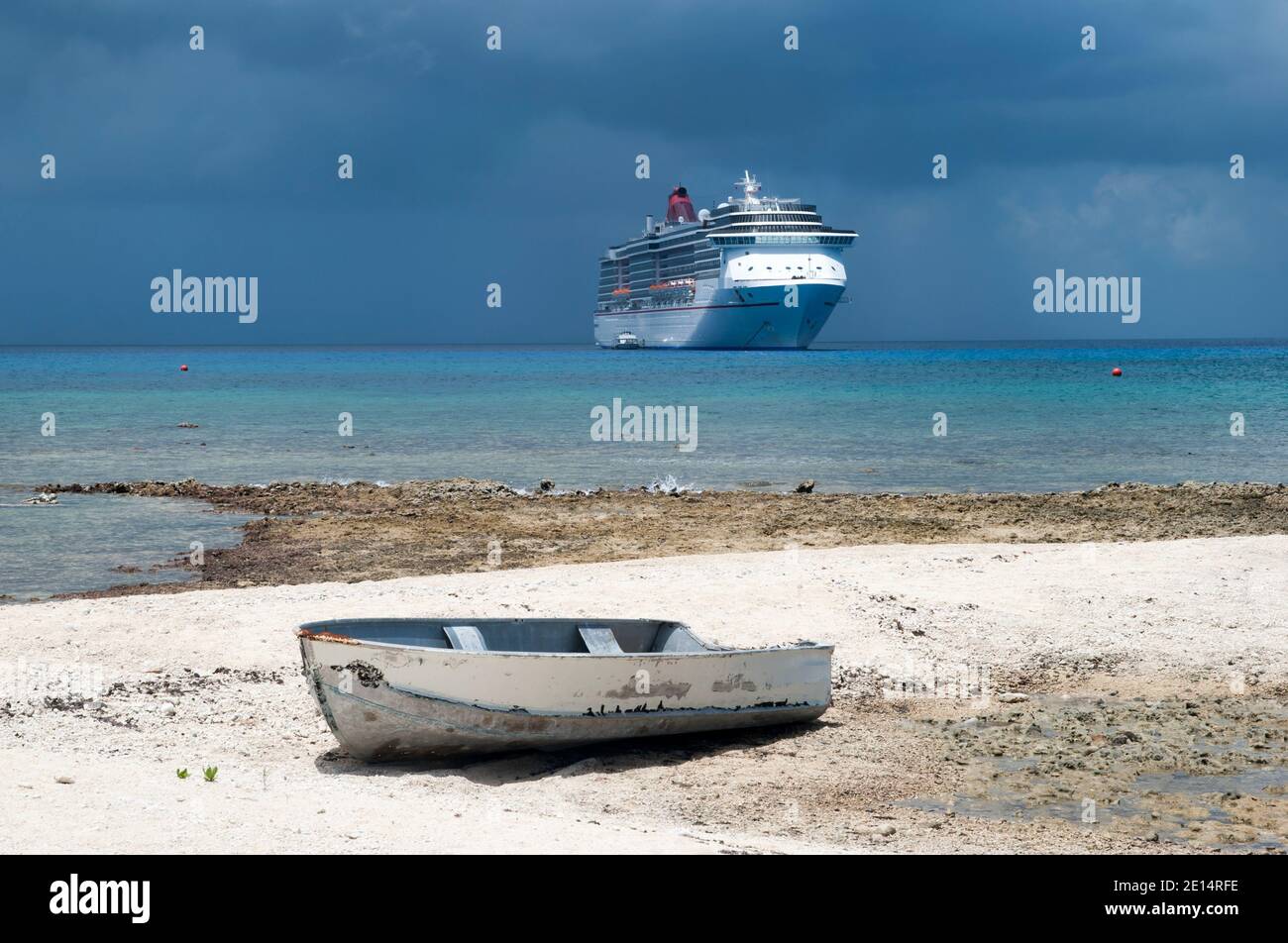 The view of an old little boat on Grand Cayman island Seven Mile Beach ...
