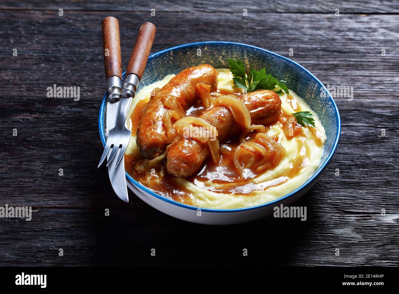 Bangers and mash traditional british dish of pork sausage with onion ...