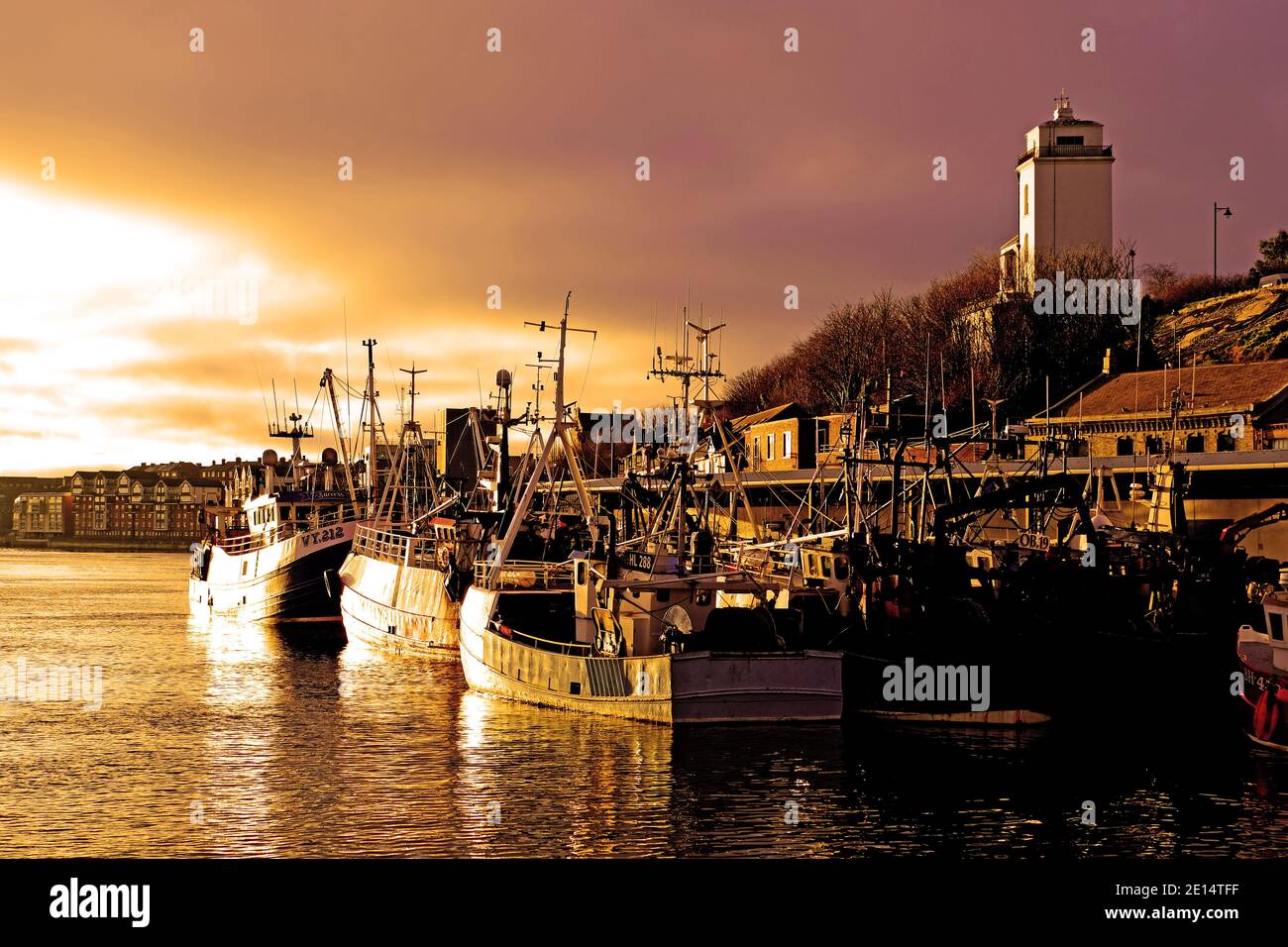 Moody sunset with fishing boats and High Lights lighthouse at North ...