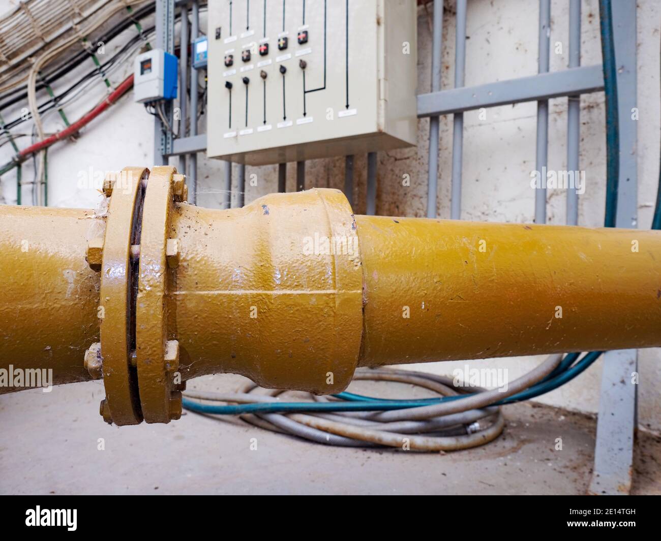 Bent vintage thick wall pipeline for warm sludge water in wastewater ...