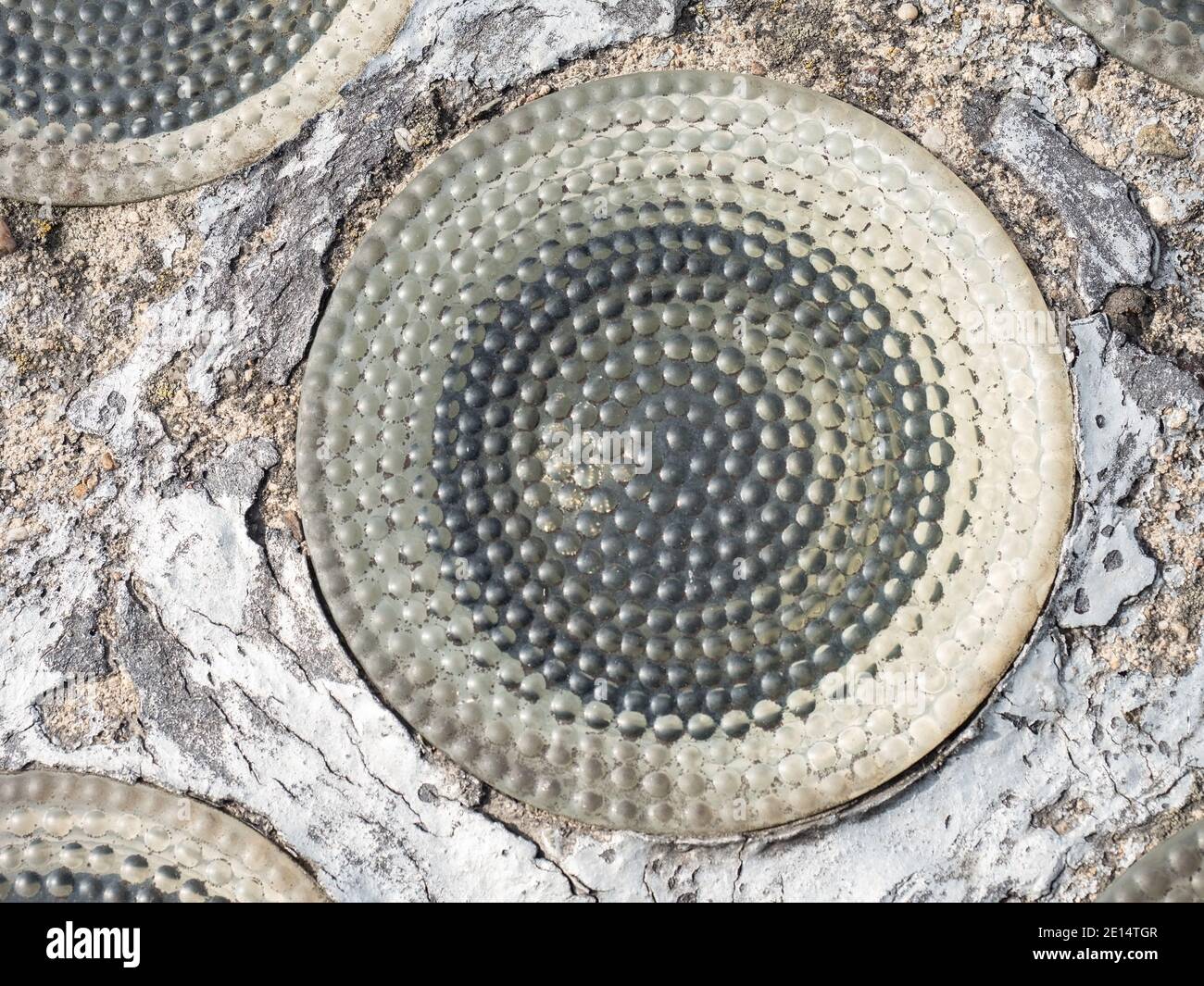 Round glass brick wall in detail. Glassy bricks with dotted structure ...