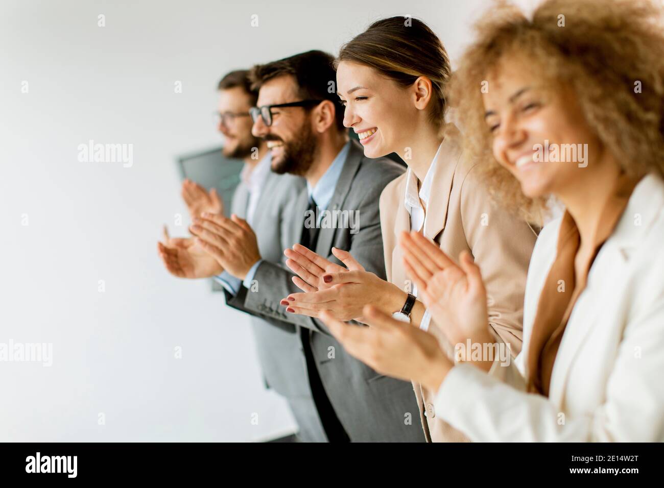 Smiling business group clapping after the meeting Stock Photo - Alamy