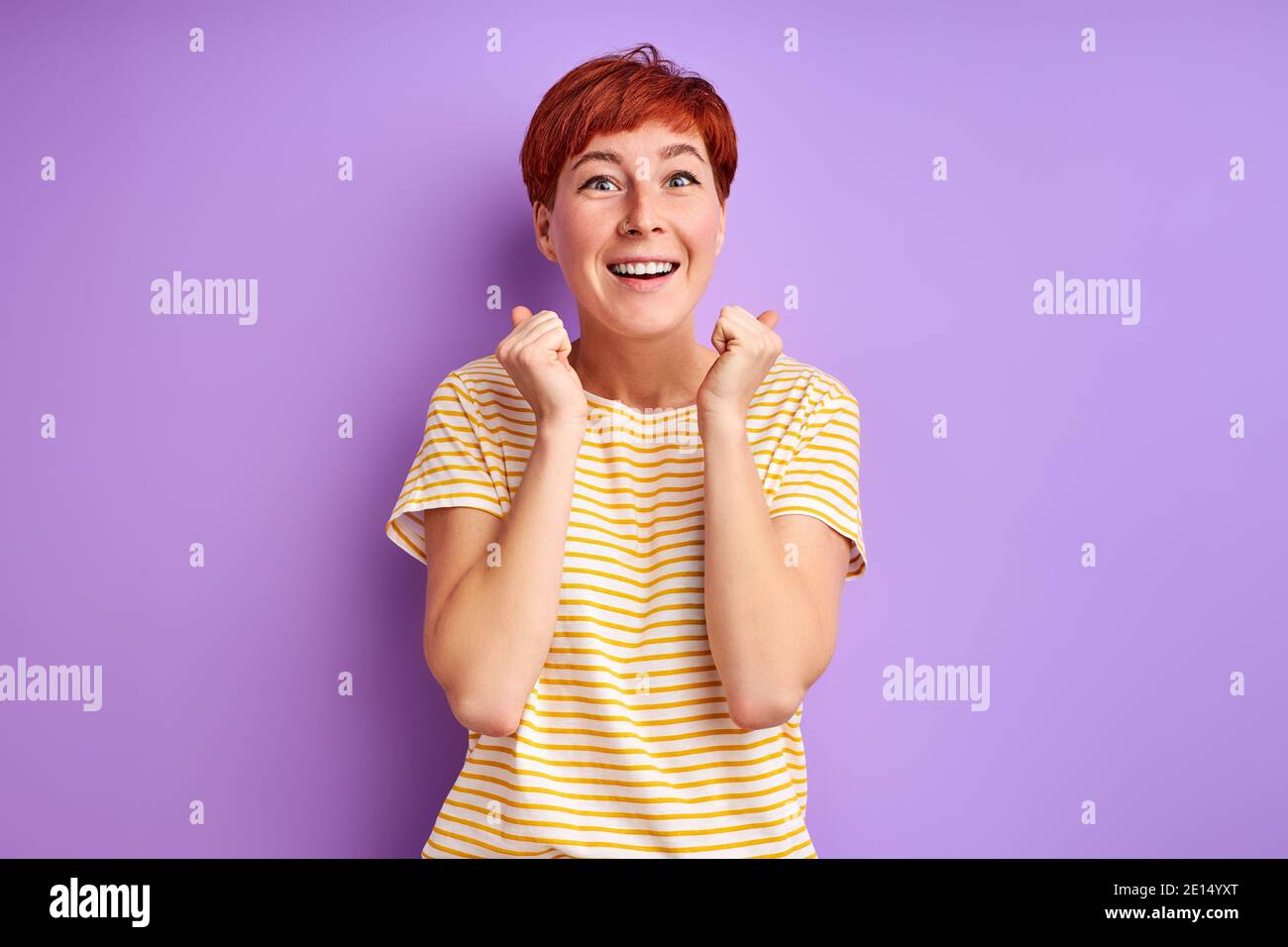 excited woman is surprised by something, stand shouting, expressing ...
