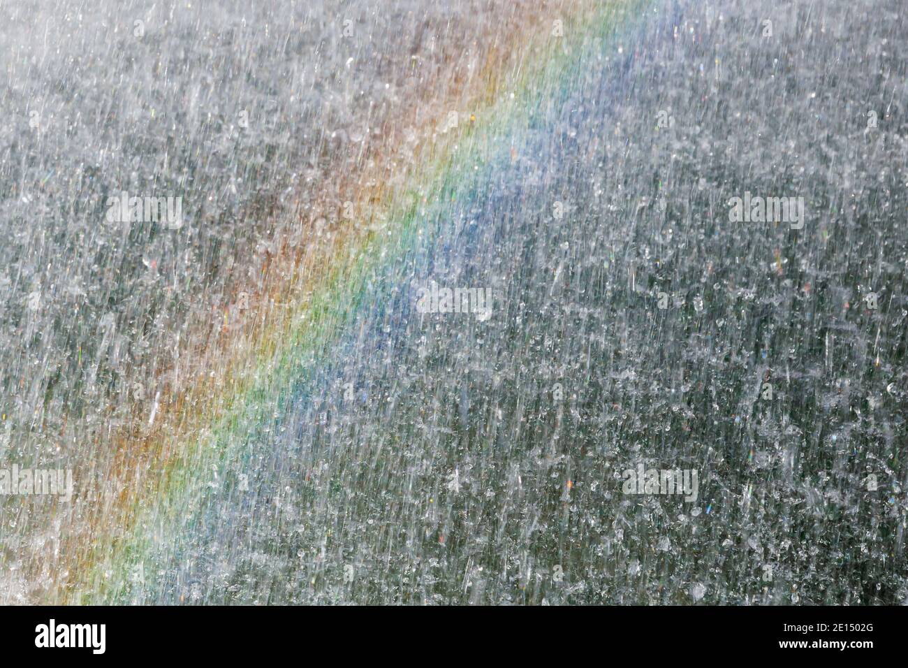 picture with a rainbow appearing in the spray mist of a fountain Stock ...