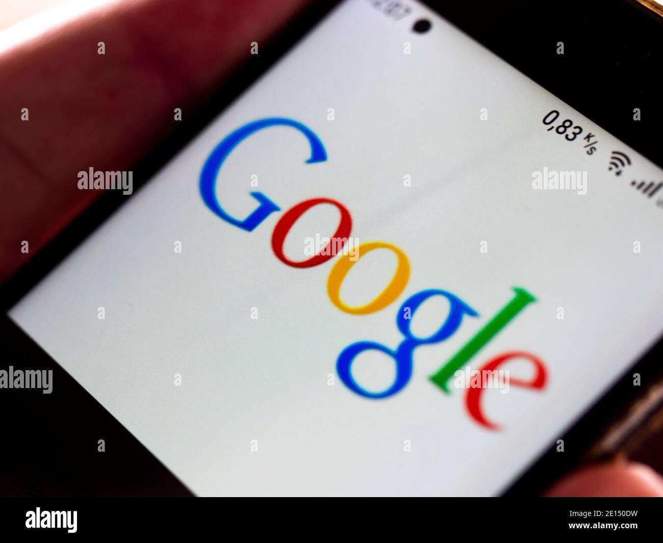 In this photo illustration a Google logo seen displayed on a smartphone ...