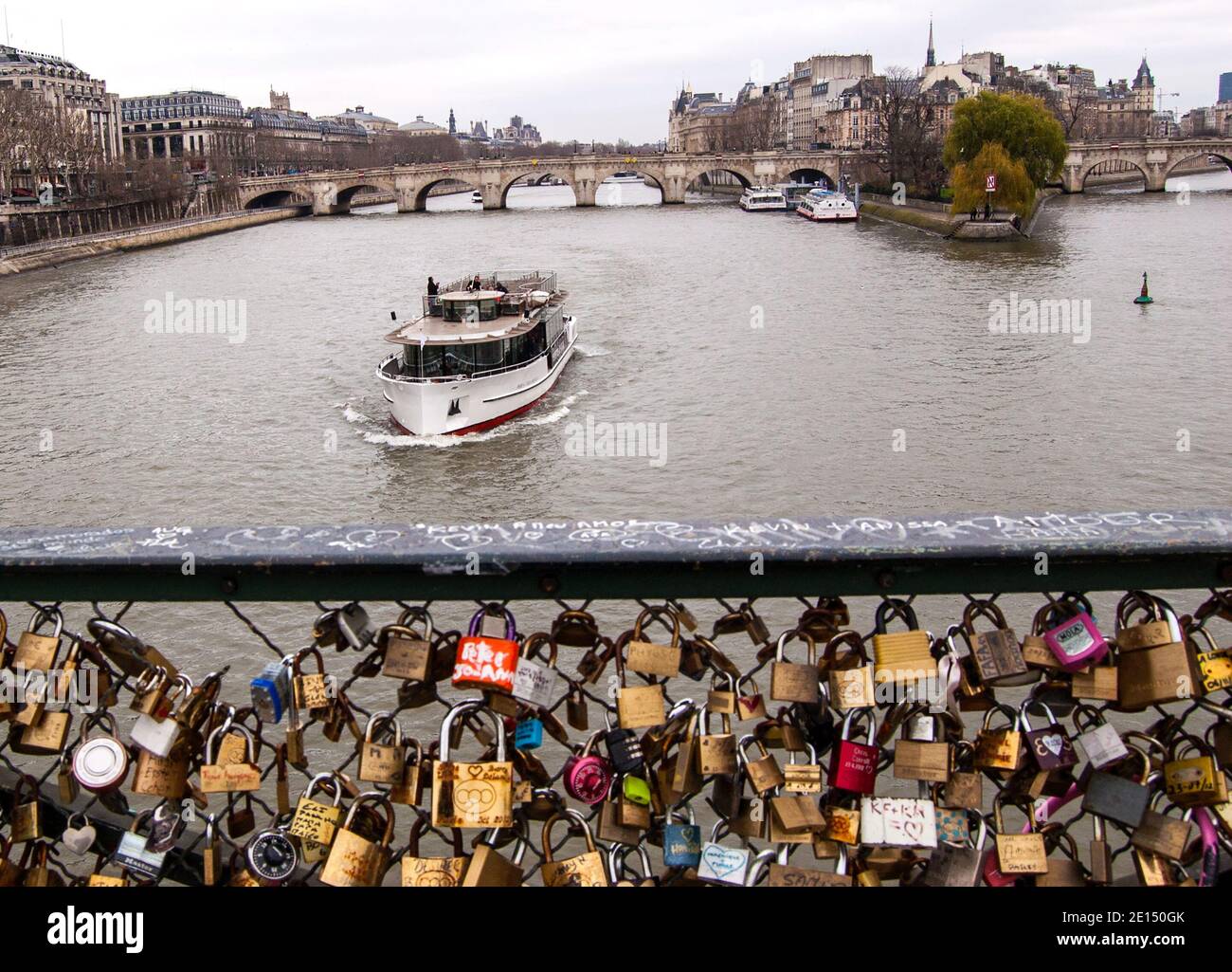 View from love locks bridge. Seine, tourist boat with tourists ...