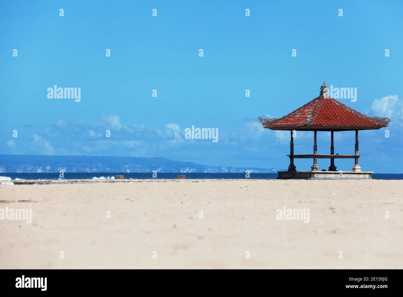 seascape background with bright sun and traditional tent on Bali island ...