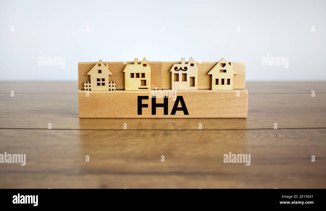 FHA, federal housing administration symbol. Wooden block with word 'FHA ...