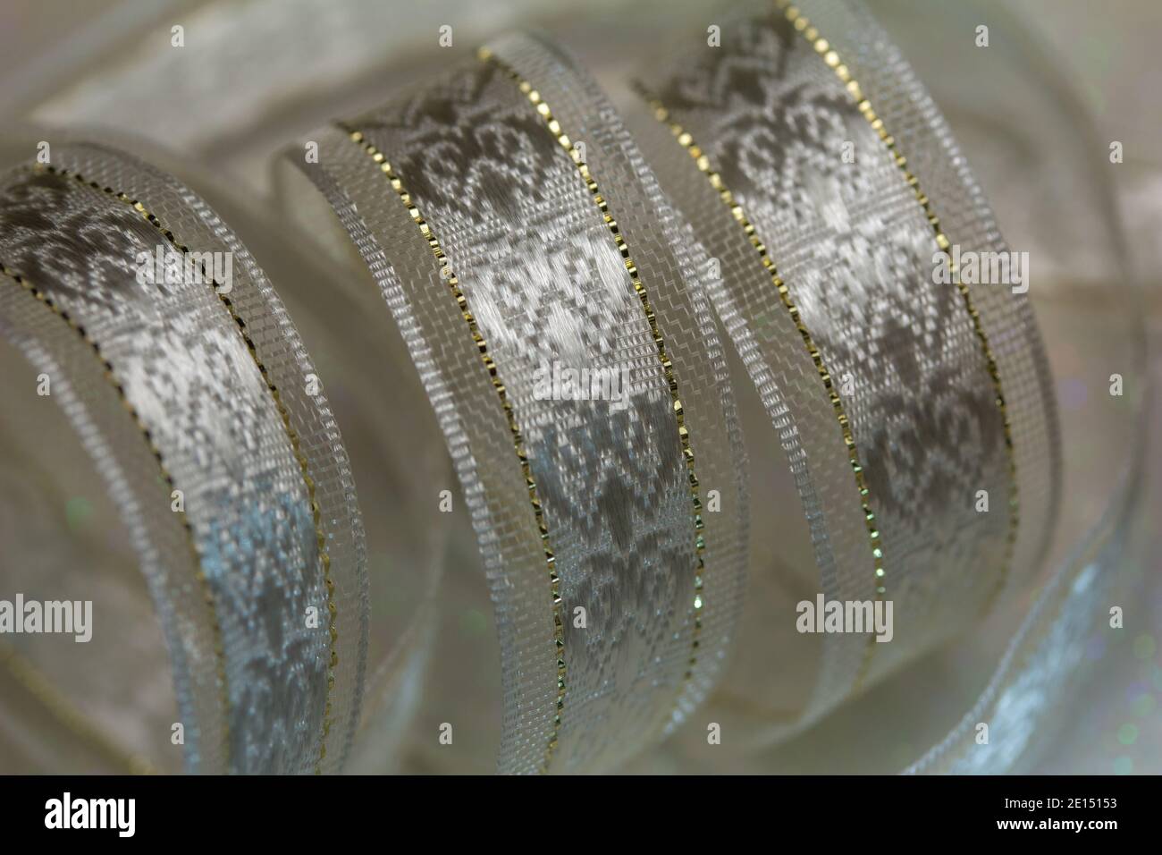 Macro full frame texture abstract of shimmering silvery white brocade ...