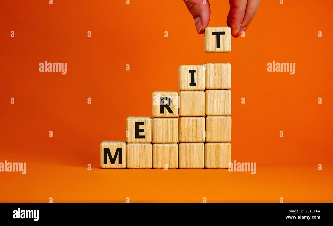 Merit symbol. Wood cubes with word 'merit' stacking as step stair on ...