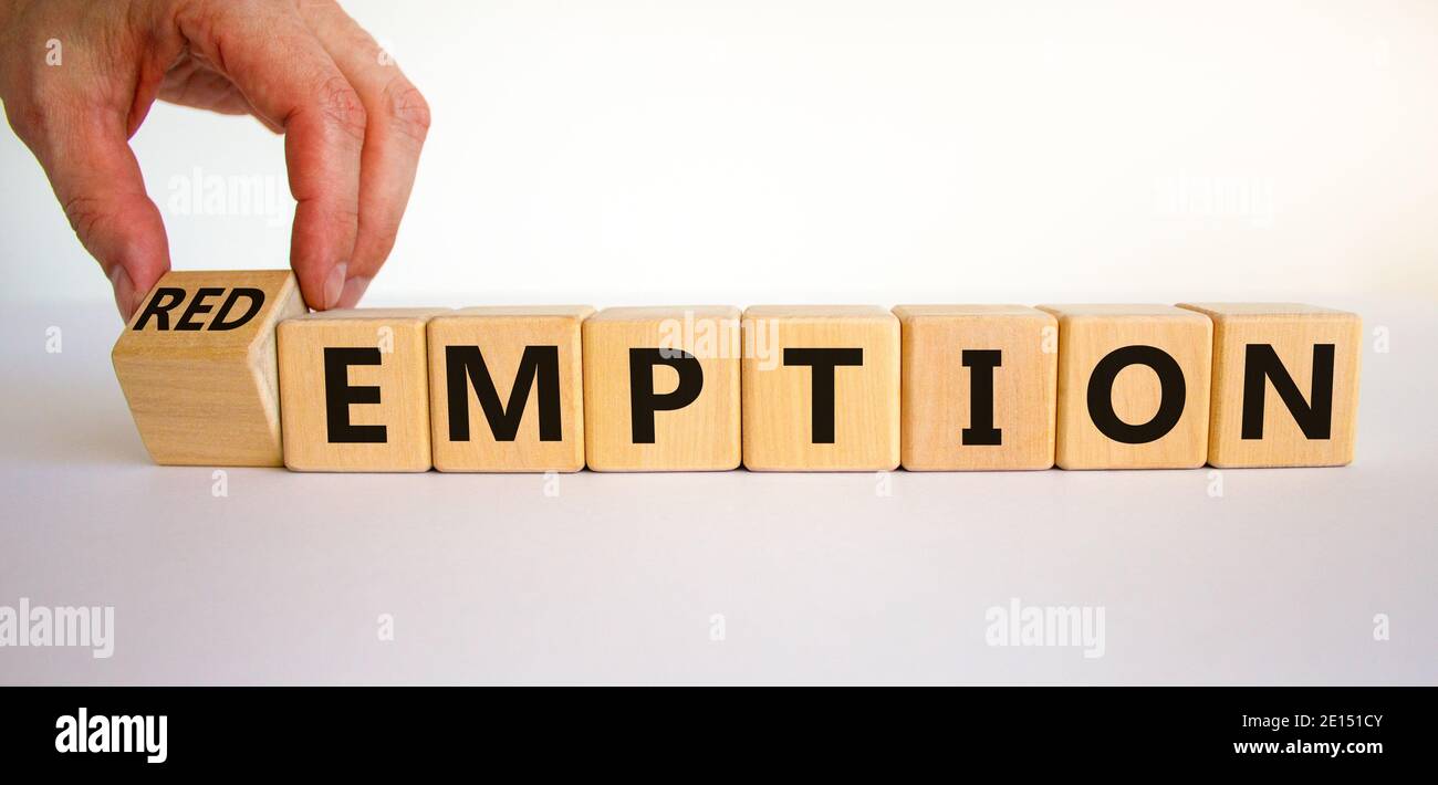 Redemption or emption symbol. Male hand turns a wooden cube and changes ...