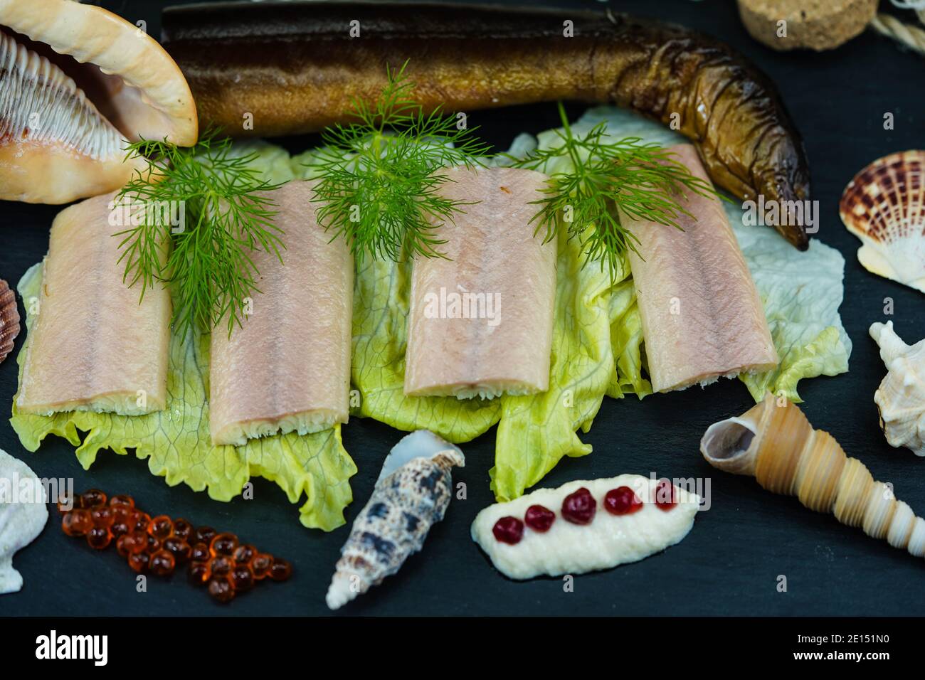 Fillet of a golden smoked eel Stock Photo - Alamy