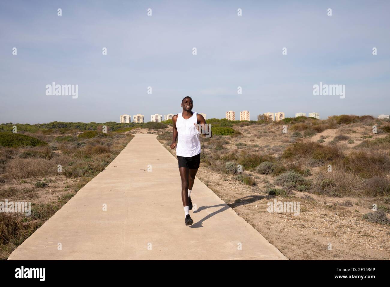 Young black sports coach running. Concept of sport Stock Photo - Alamy