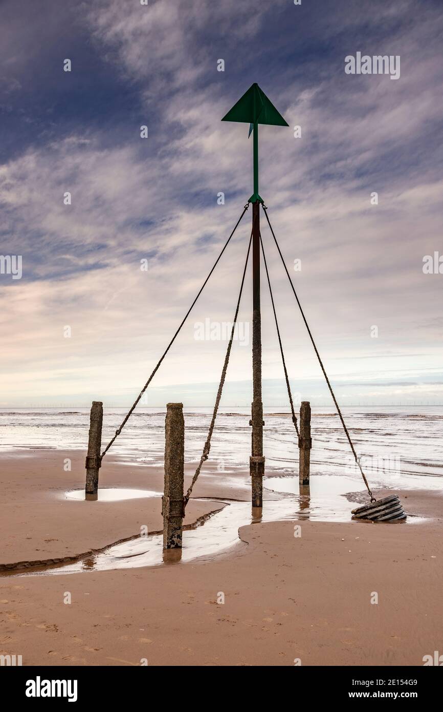 Marker post on Prestatyn Beach, North Wales Stock Photo - Alamy