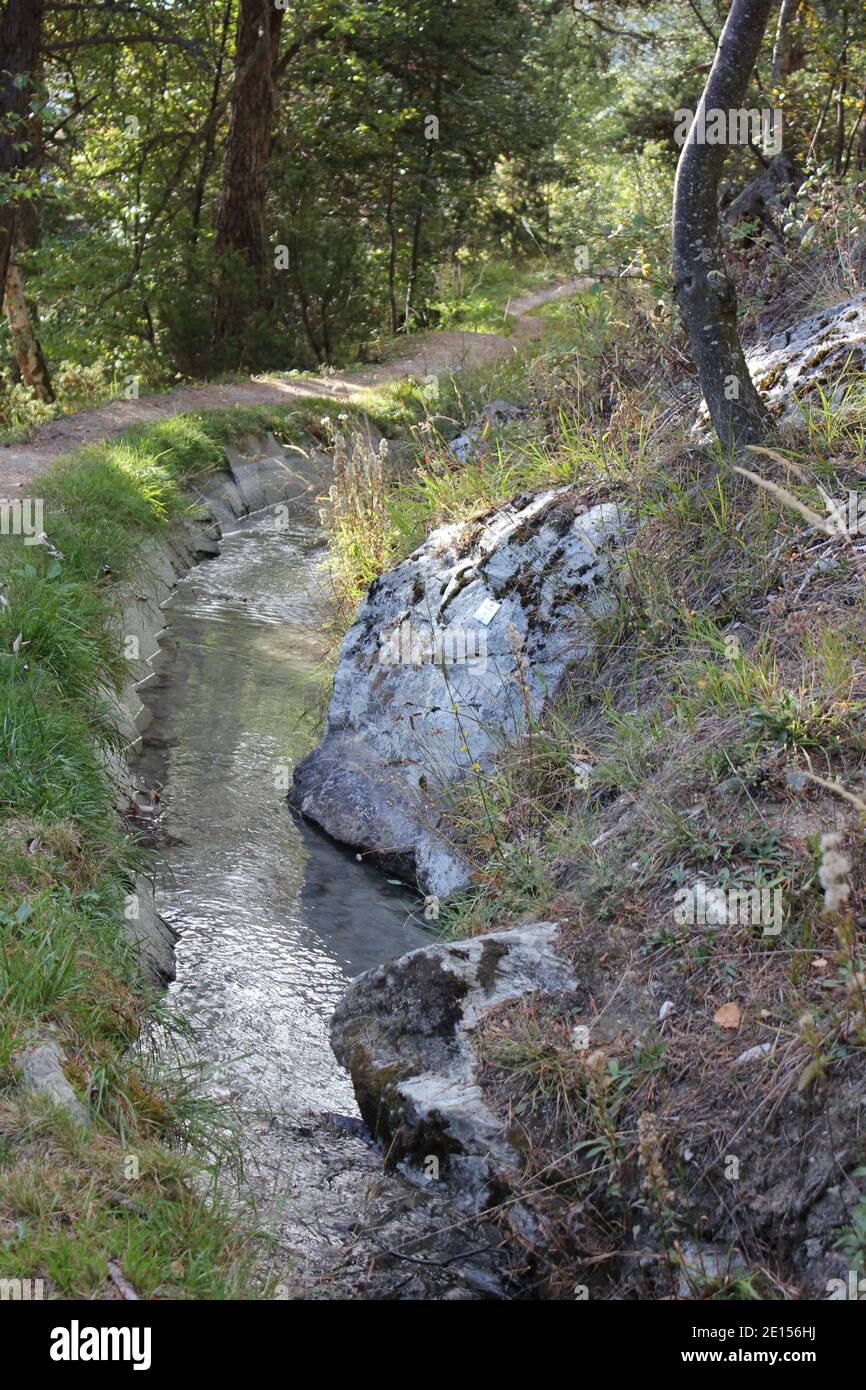 Traditional water system in the Swiss mountains Stock Photo - Alamy
