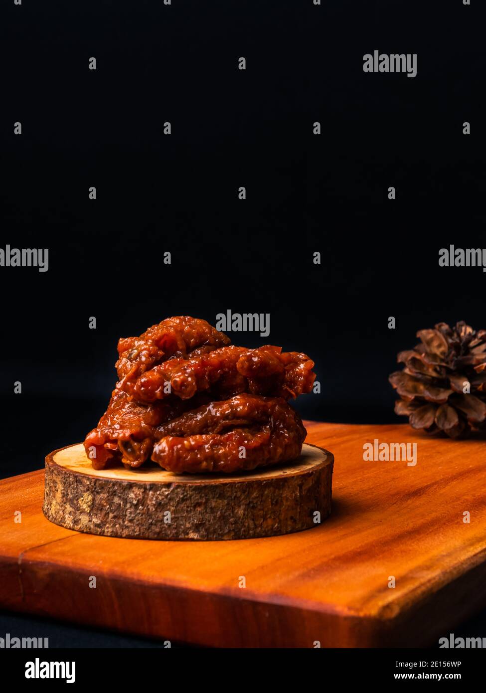 phoenix claw dim sum on a wooden plate in a dark background. take the ...