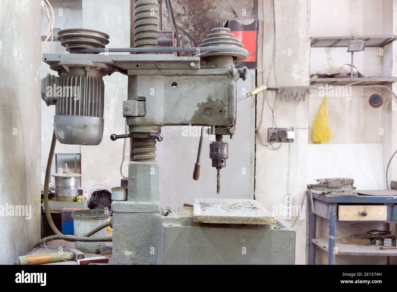 Old drilling machine in the production hall. Close-up Stock Photo - Alamy
