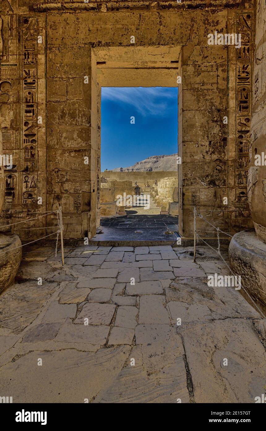 Looking towards the outer mud brick wall. through the ruined columns of ...
