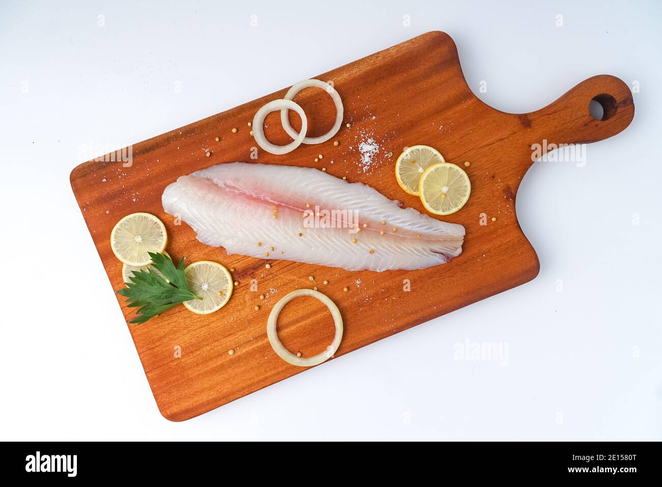 fresh fillet dory fish on wooden tray Stock Photo - Alamy