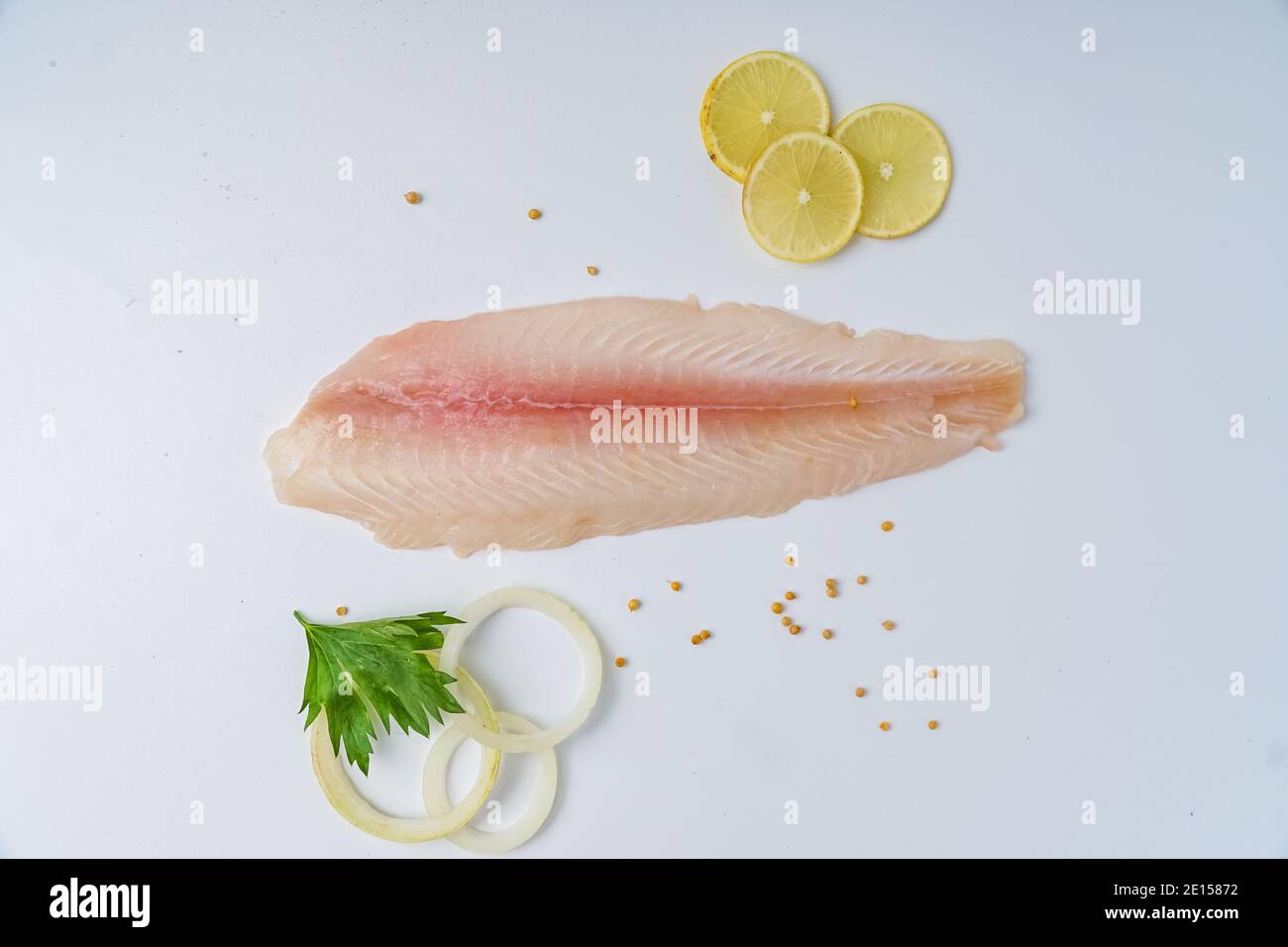 fresh fillet dory on a white background Stock Photo - Alamy