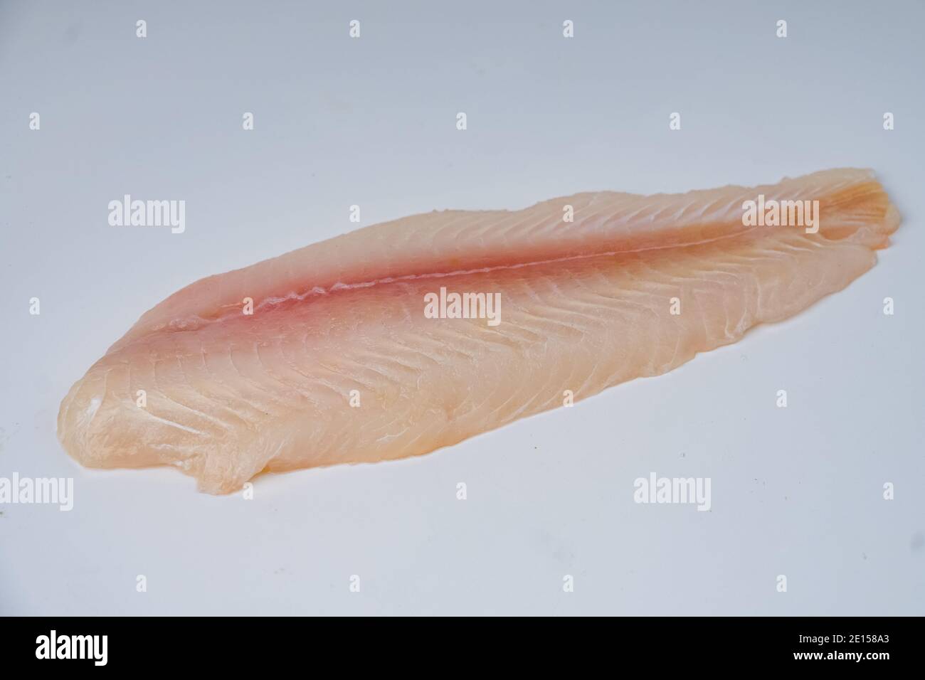 fresh fillet dory on a white background Stock Photo - Alamy