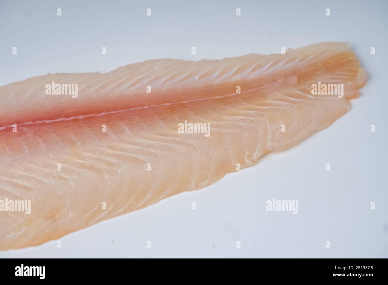 fresh fillet dory on a white background Stock Photo - Alamy