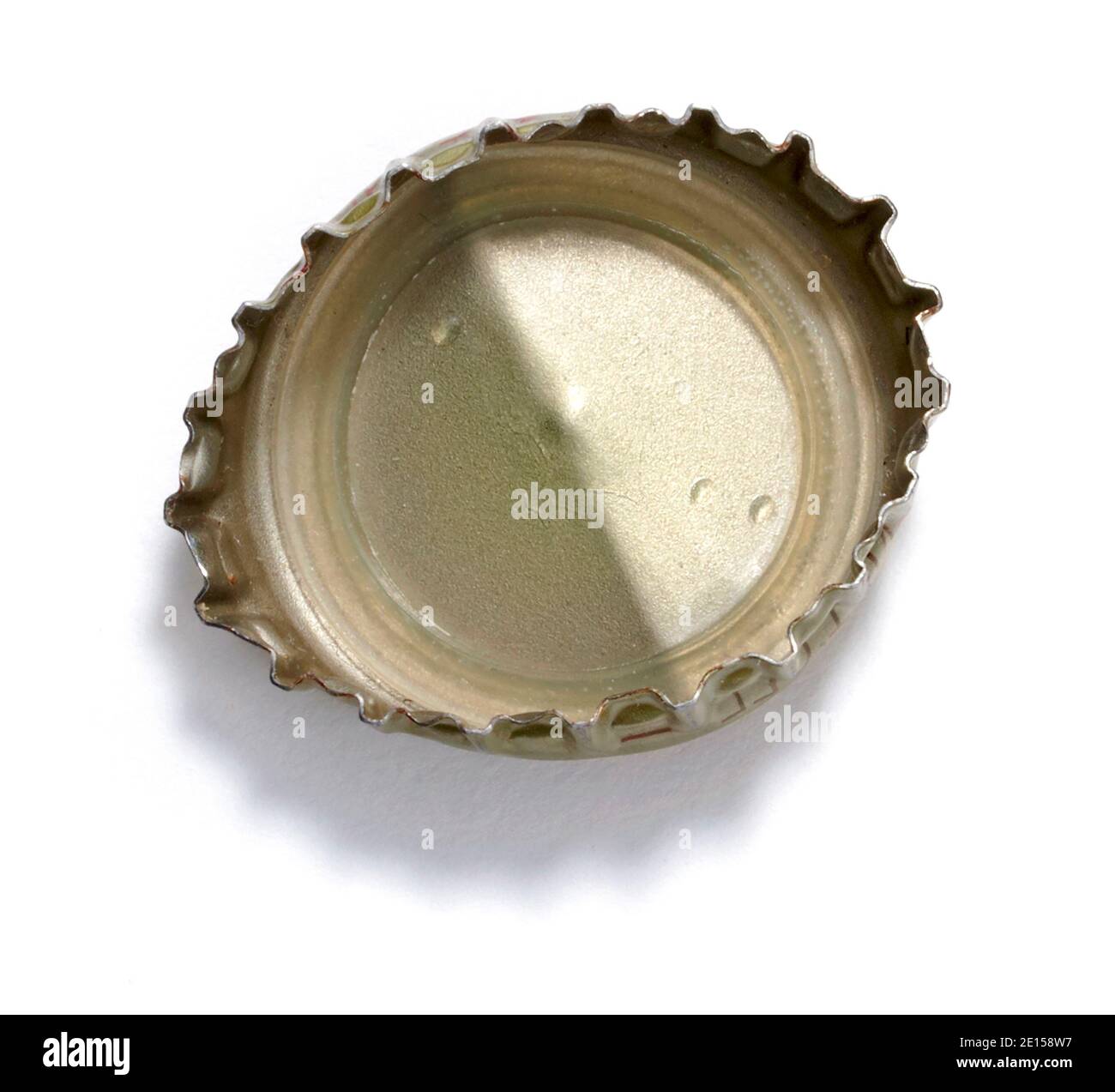 Bent bottle cap photographed on a white background Stock Photo - Alamy