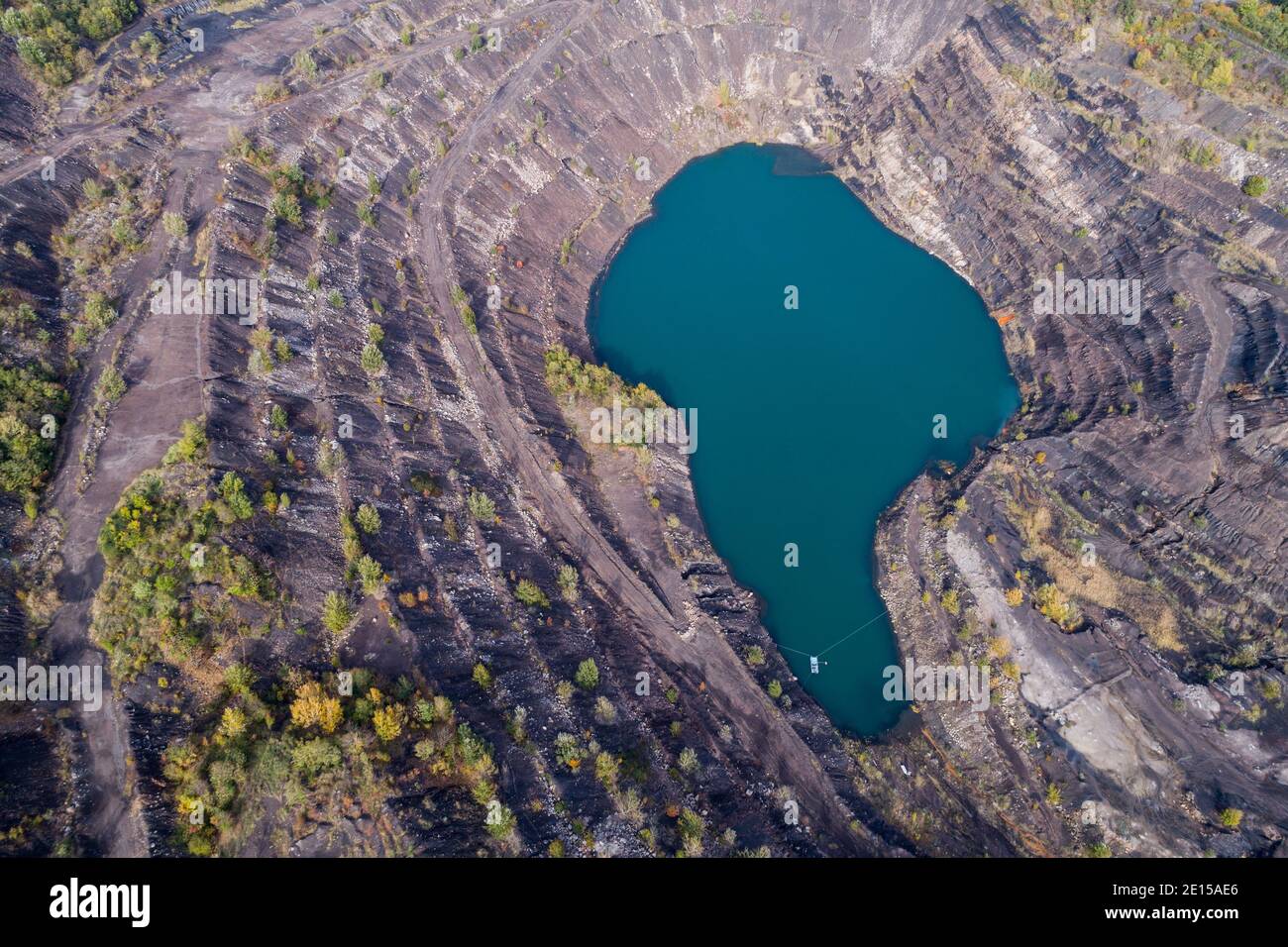 Aerial view, deep mine lake in place of a mining pit Stock Photo - Alamy