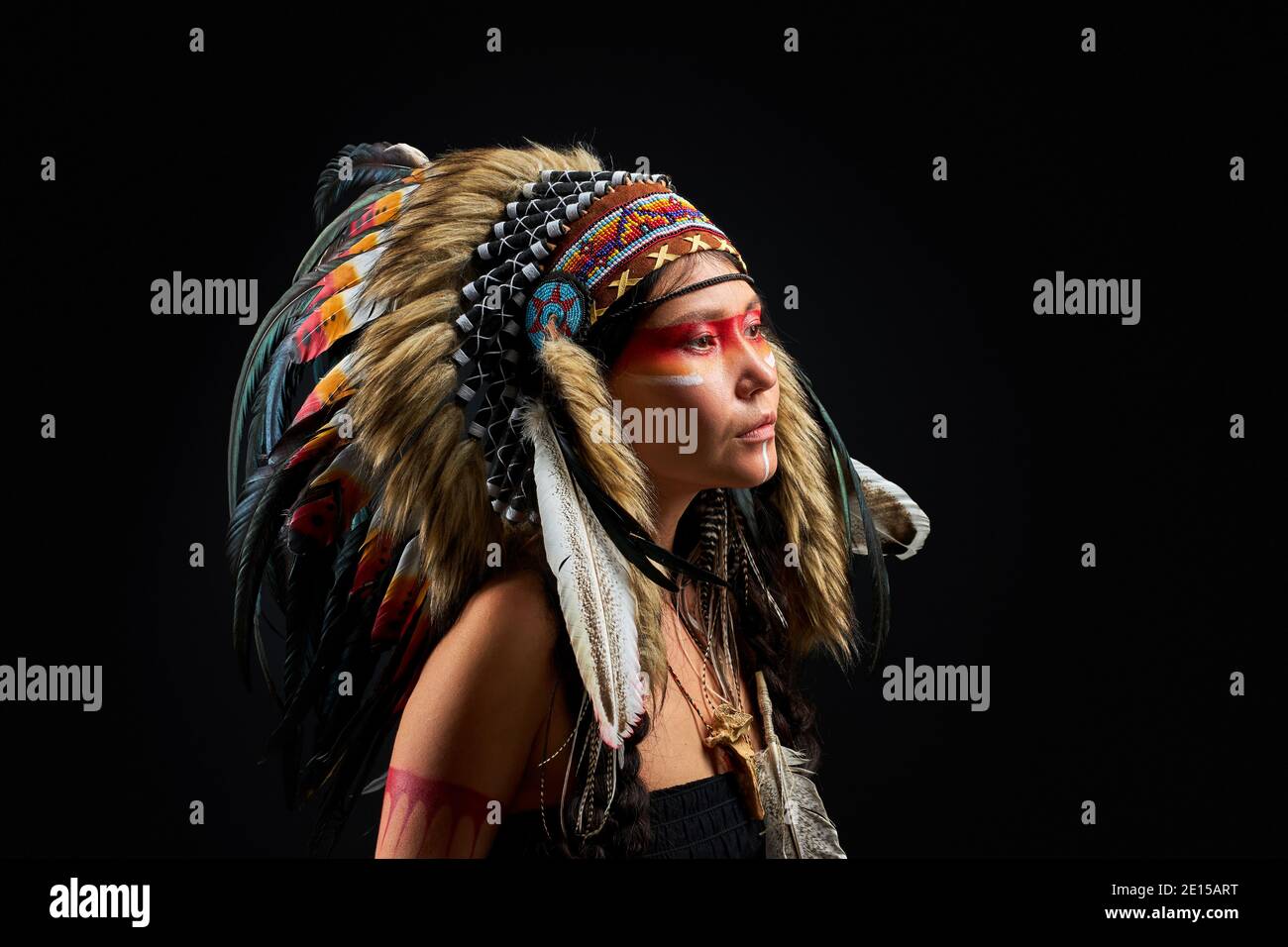 indian shamanic female with Indian feather wearing and colorful makeup ...
