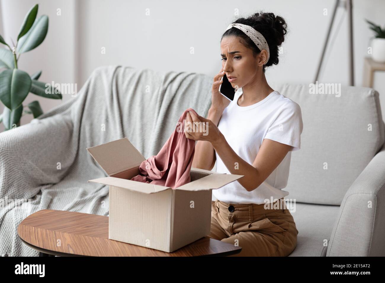 Person opening cardboard box hi-res stock photography and images - Alamy