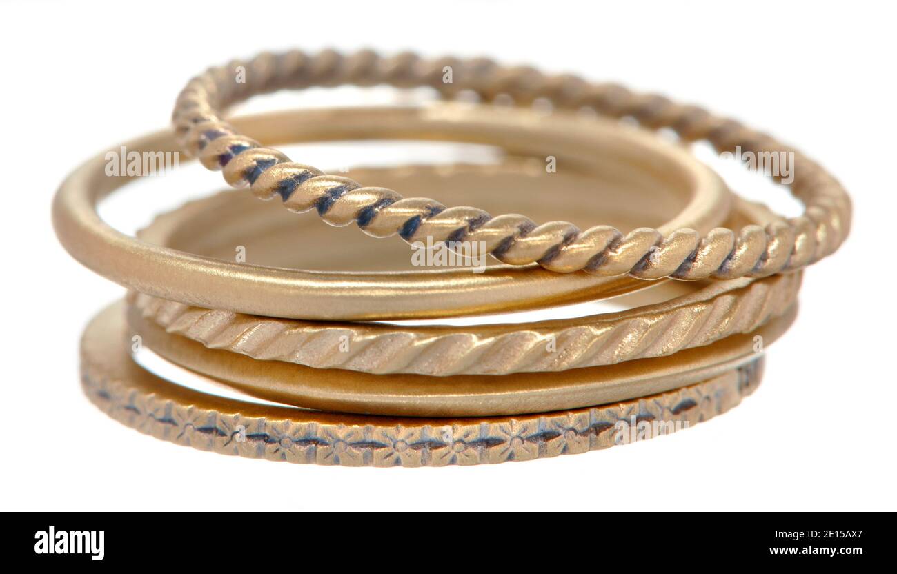 Stack of gold rings photographed on a white background Stock Photo - Alamy