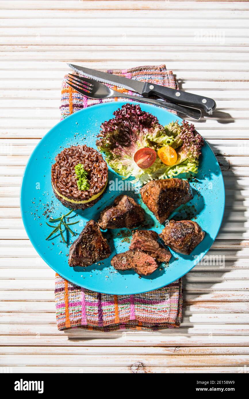 Kangaroo Steak With Red Rice And Mango Stock Photo - Alamy