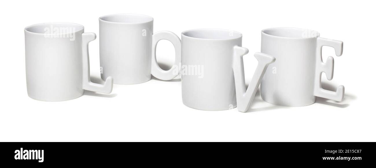 Alphabet mug set with letter handles spelling "LOVE" photographed on a ...