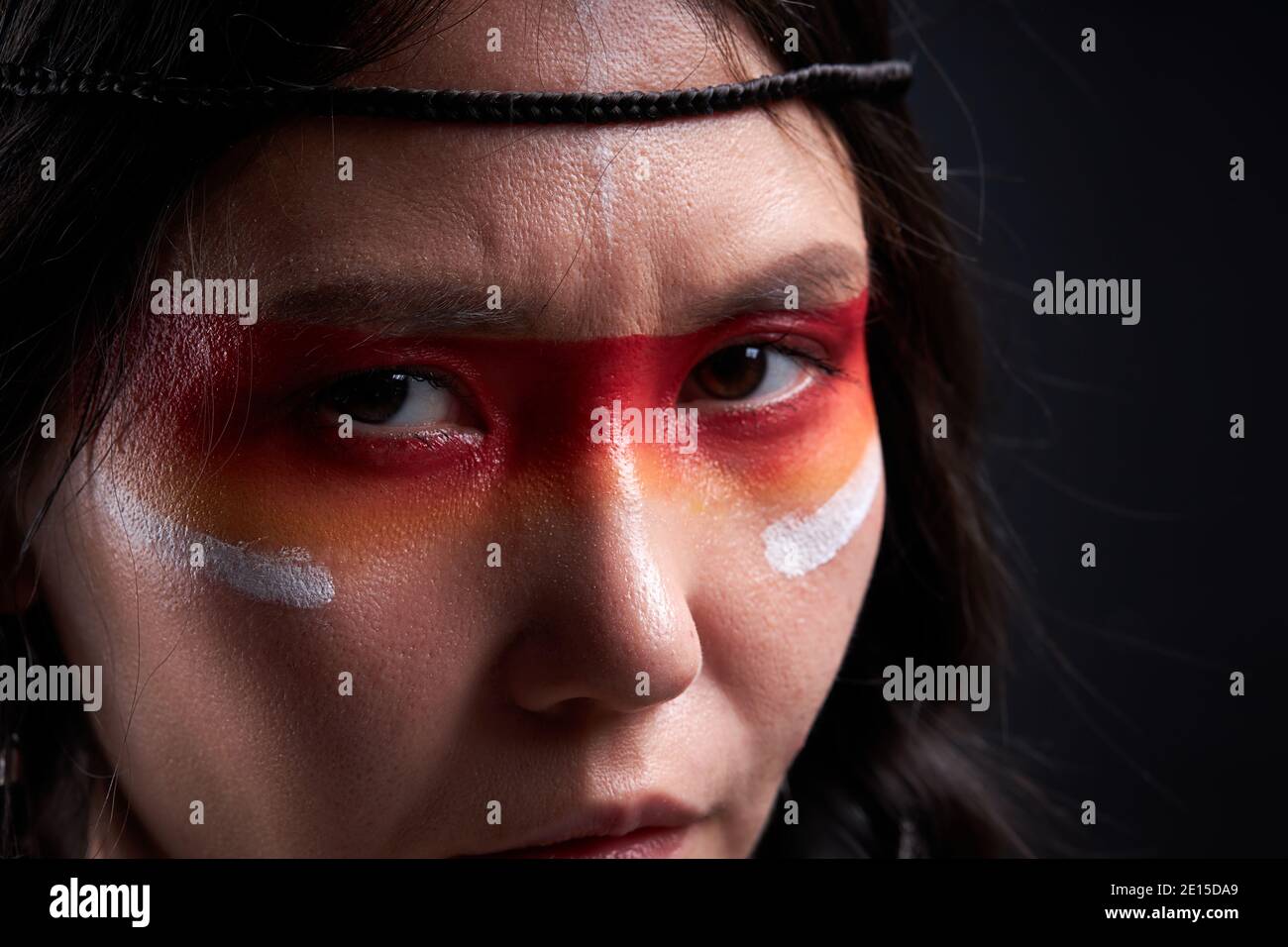 shamanic woman with warrior shaman make up isolated in studio ...