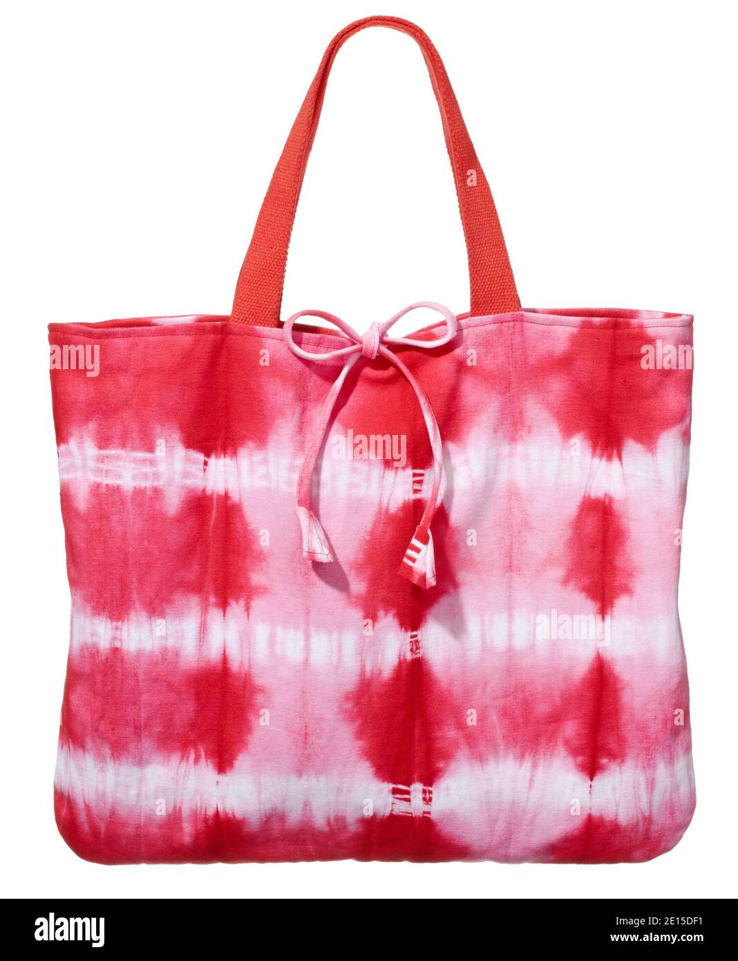 Pink tie dye bag photographed on a white background Stock Photo - Alamy