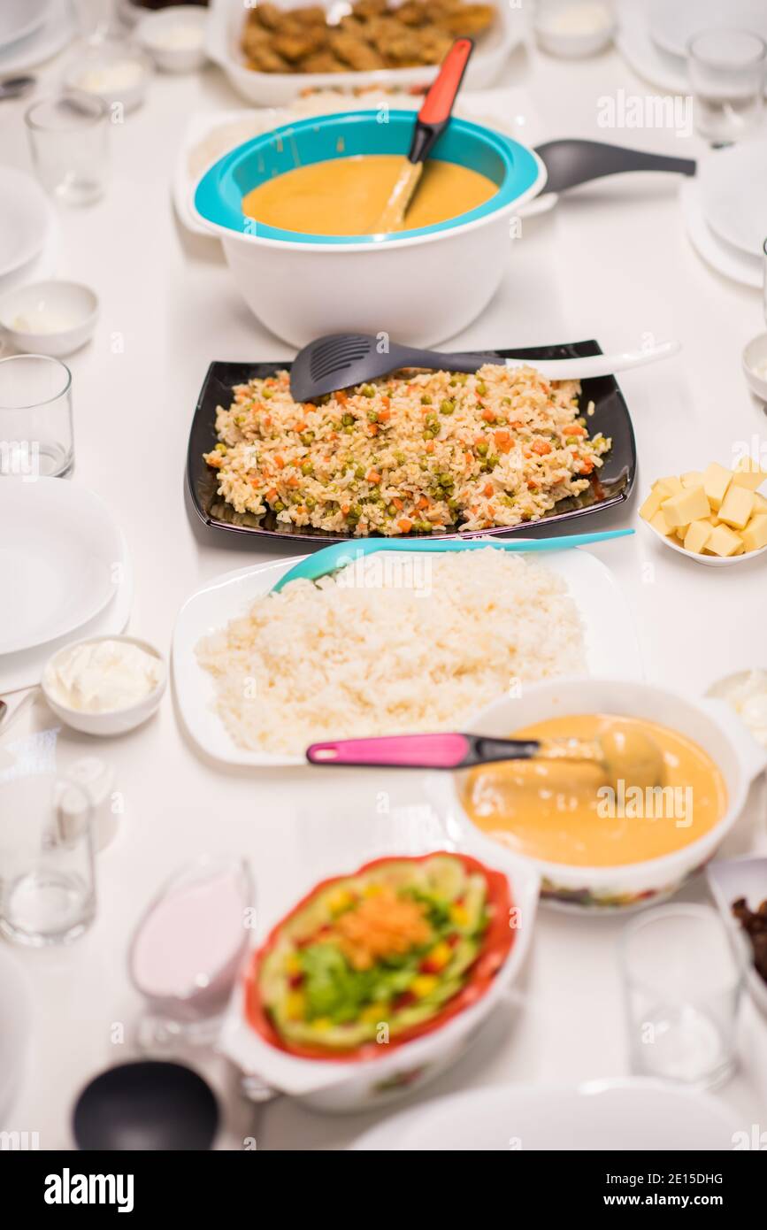 Beautiful ready lunch on dining table in modern home Stock Photo - Alamy
