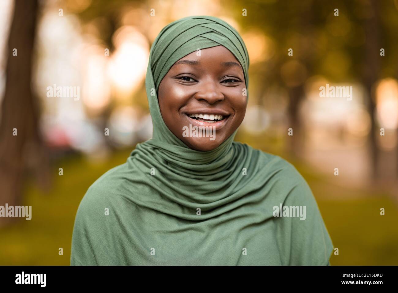 Outdoor Portrait Of Cheerful African Muslim Lady In Hijab Stock Photo ...